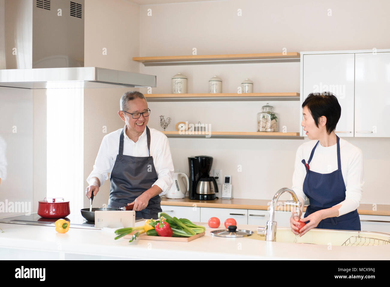 Senior couple cooking Stock Photo - Alamy