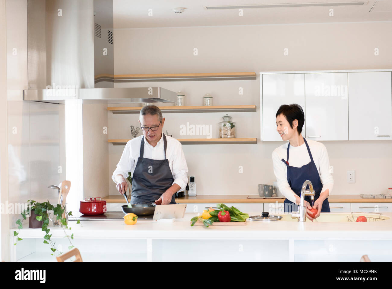 Senior couple cooking Stock Photo - Alamy