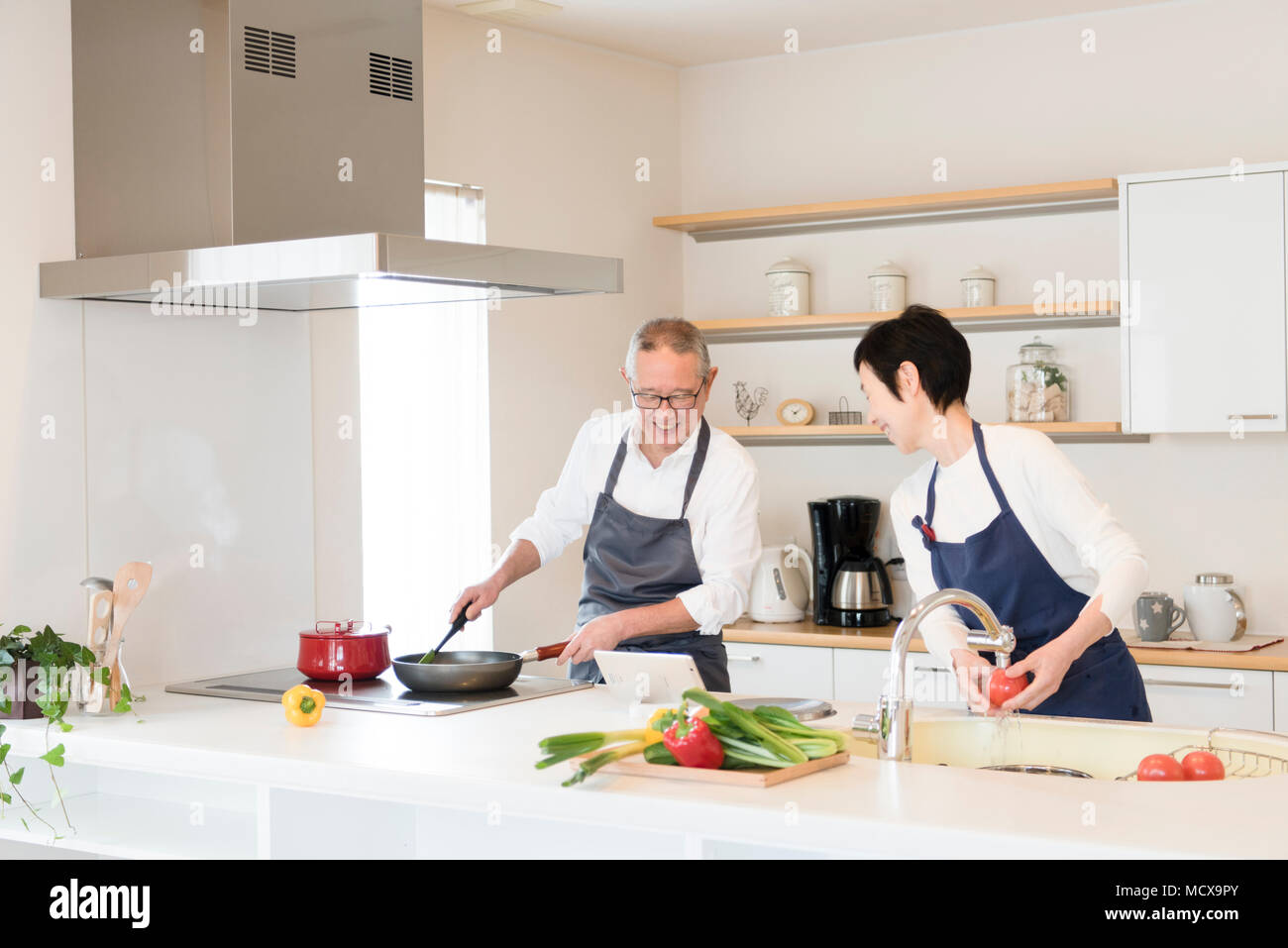 Senior adult japanese woman cooking hi-res stock photography and images ...