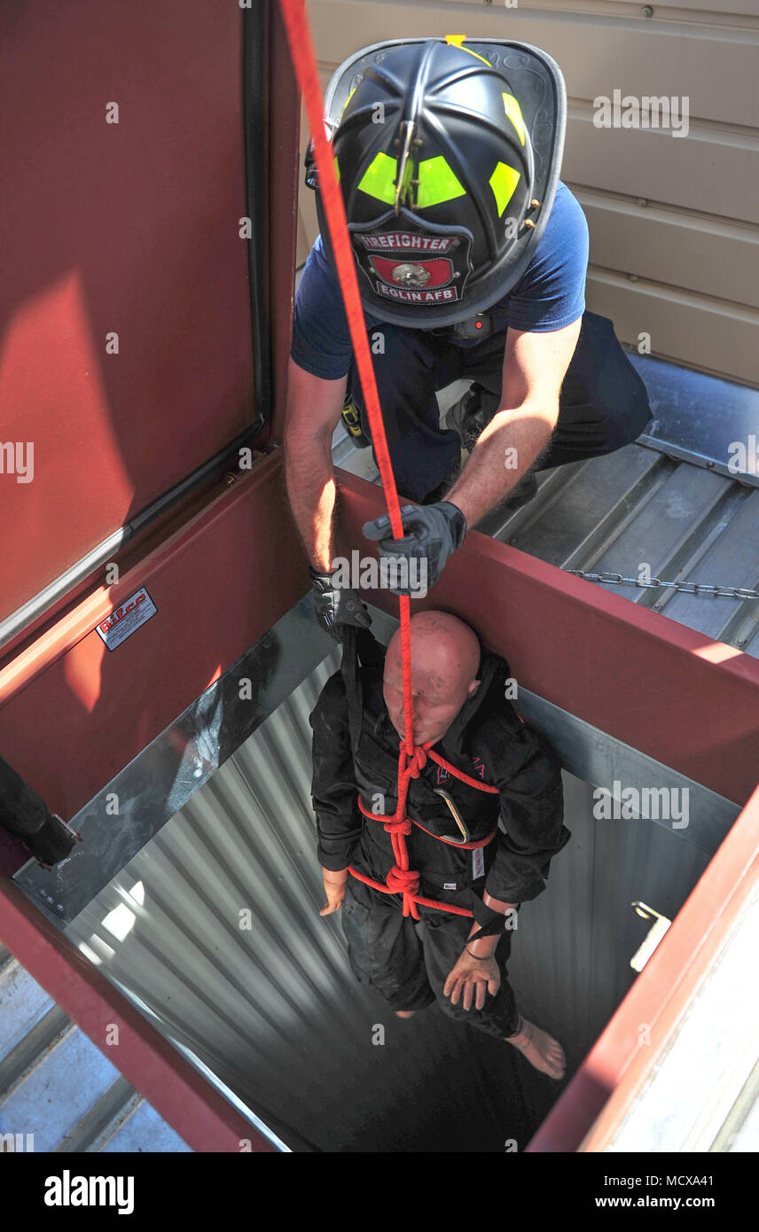 A firefighter with the 96th Civil Engineer Group, extracts a training ...