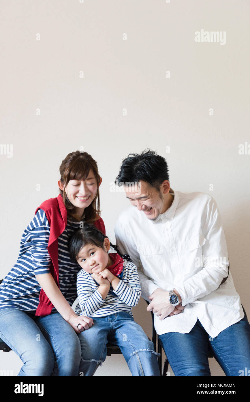 Portrait of three member of family Stock Photo - Alamy