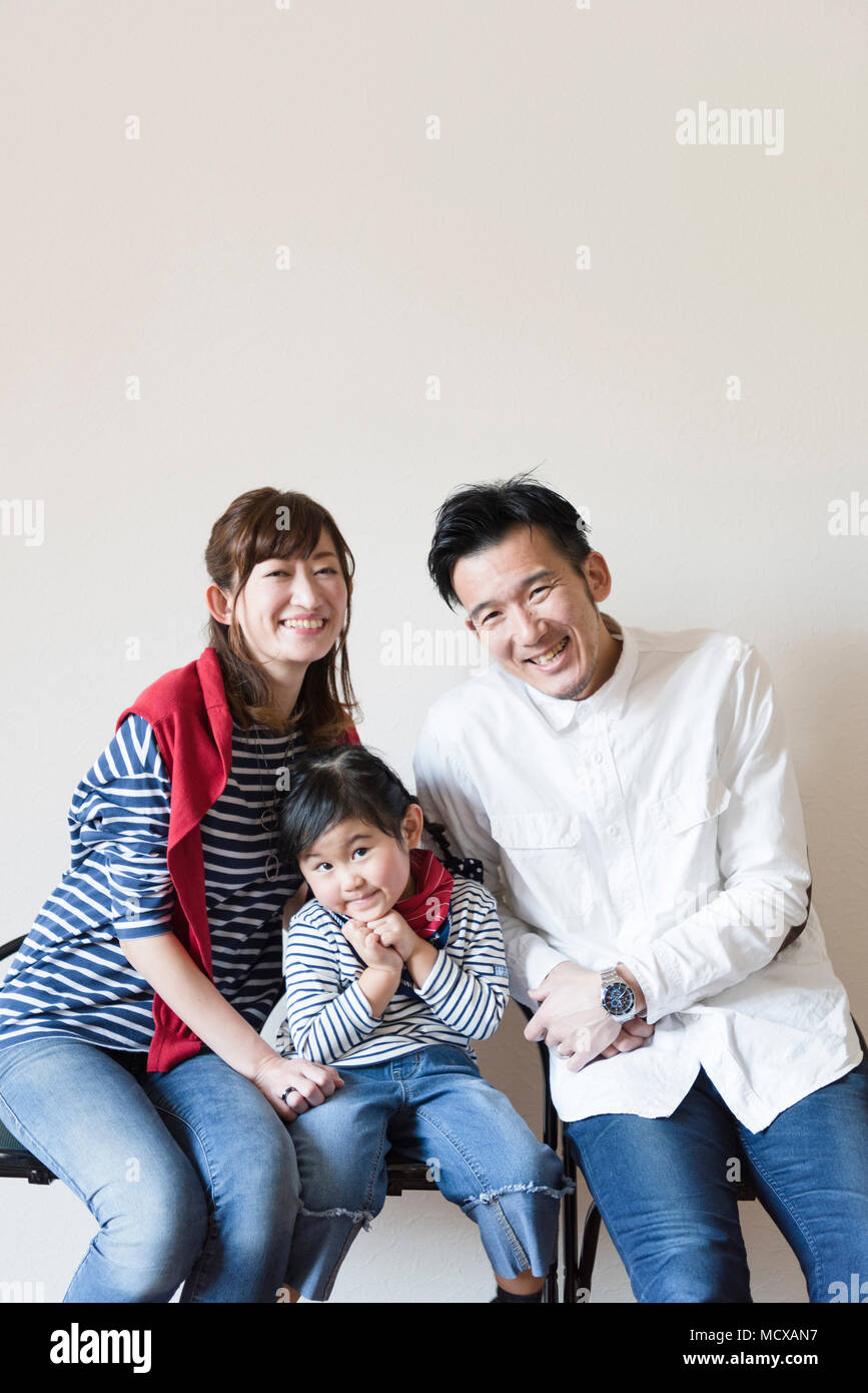 Portrait of three member of family Stock Photo - Alamy