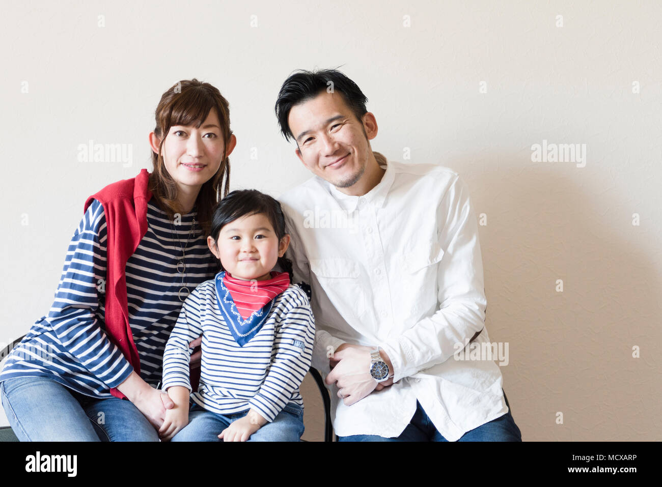 Portrait of three member of family Stock Photo - Alamy