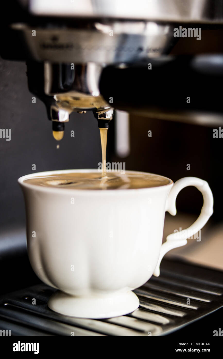 espresso machine pouring coffee to cup Stock Photo - Alamy