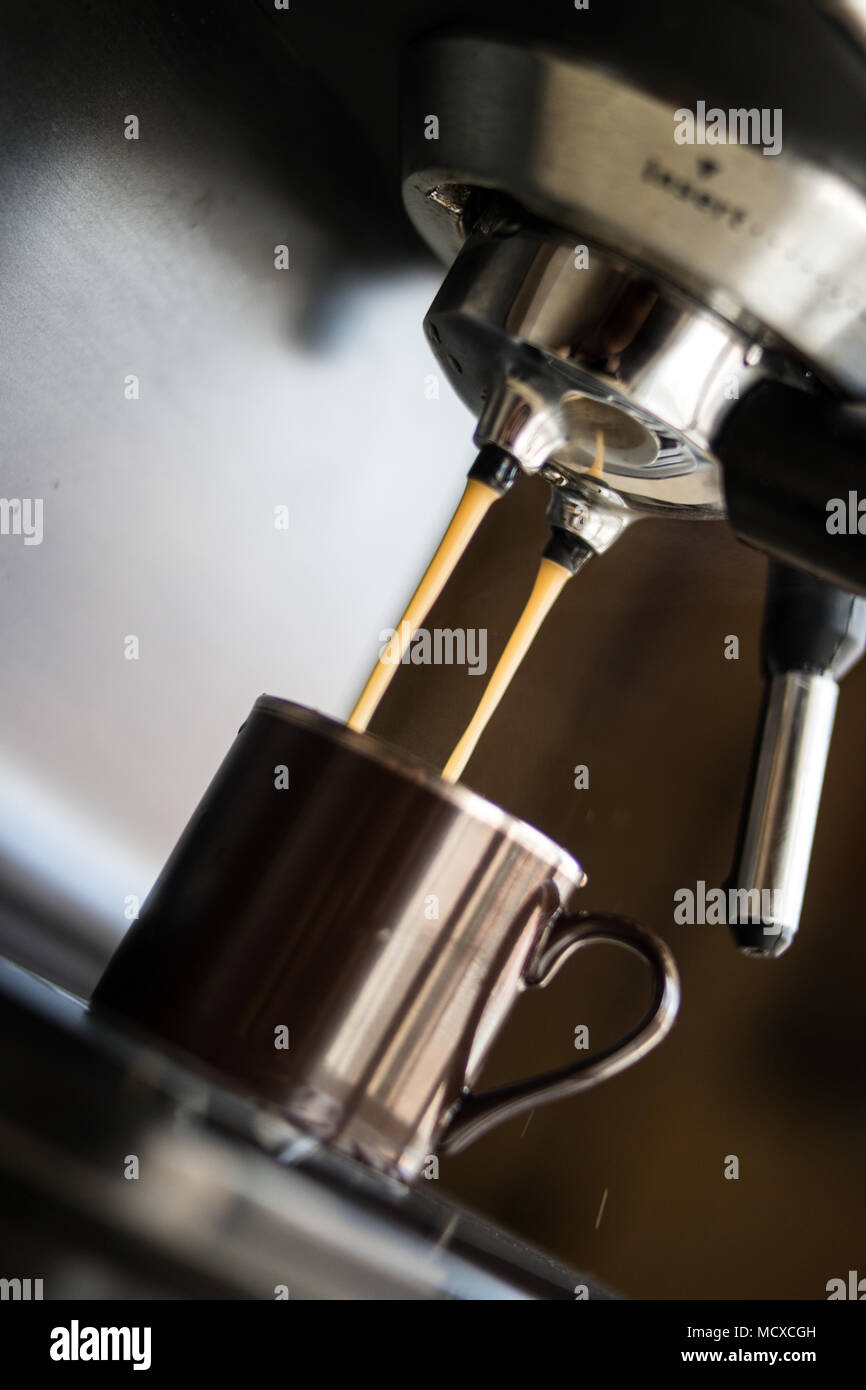 espresso machine pouring coffee to cup Stock Photo - Alamy