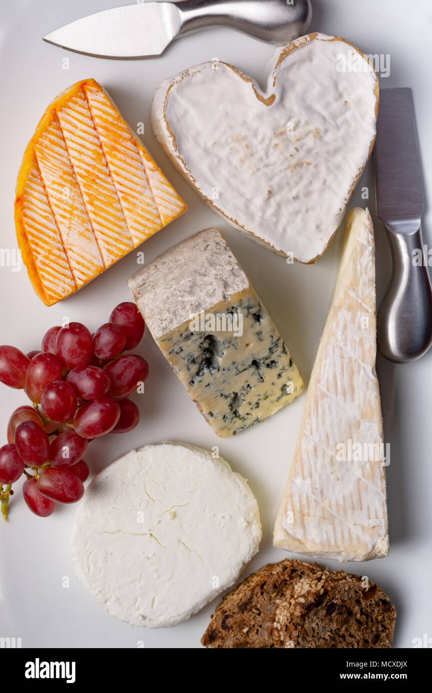 French cheeses plate in assortment, blue cheese, brie, munster, soft ...
