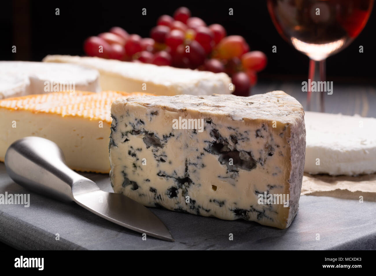 French cheeses plate in assortment, blue cheese, brie, munster, soft ...