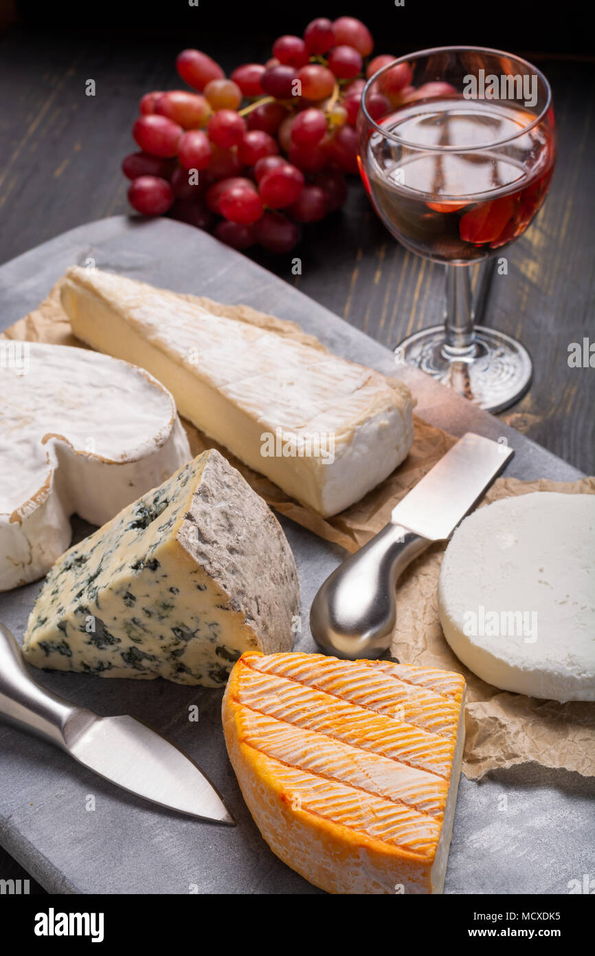 French cheeses plate in assortment, blue cheese, brie, munster, soft ...