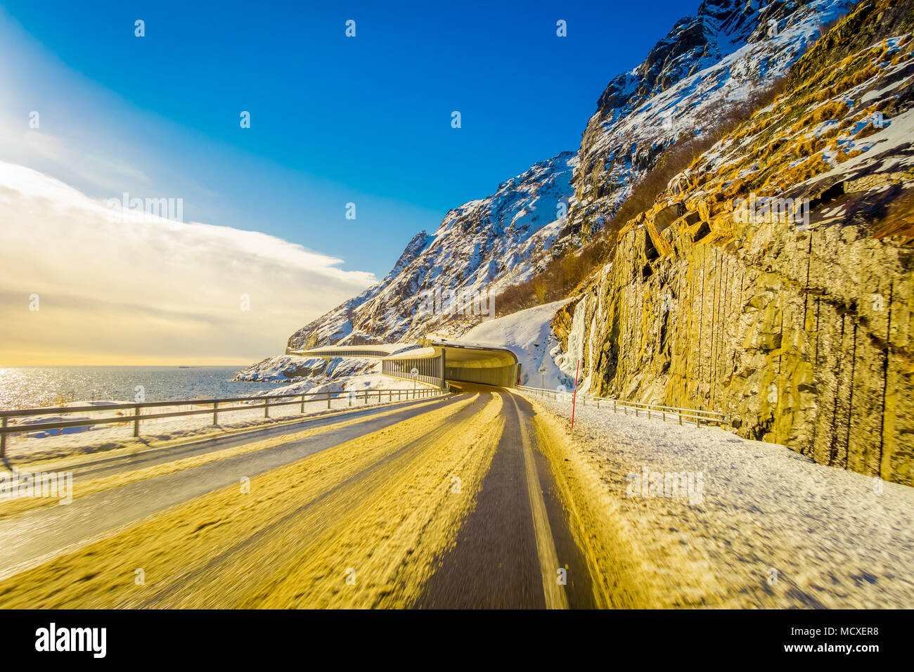 Road by the sea in sunset time, Lofoten island Stock Photo - Alamy