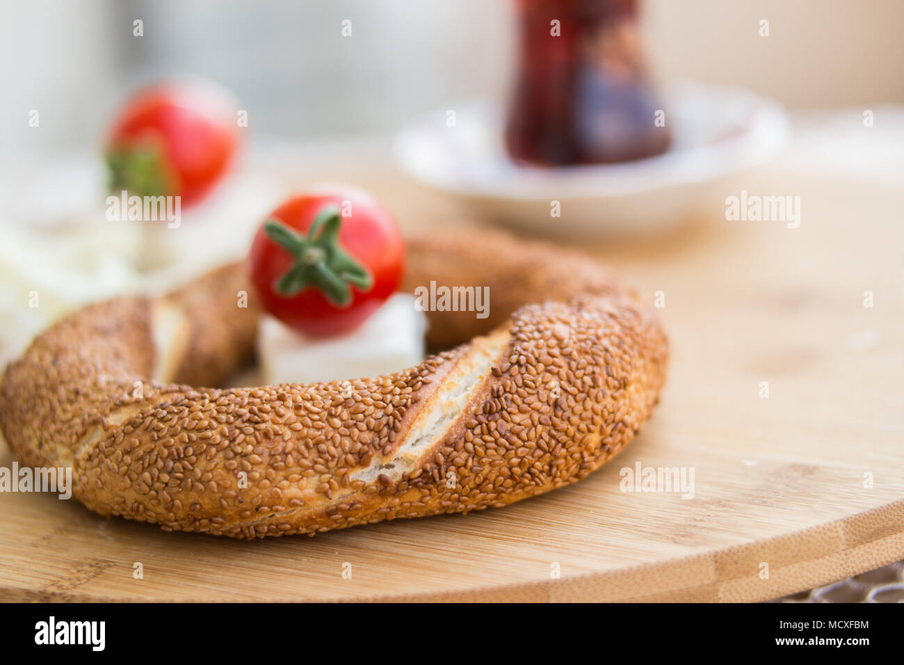 turkish bagel simit with tea, cheese and cherry tomatoes Stock Photo ...