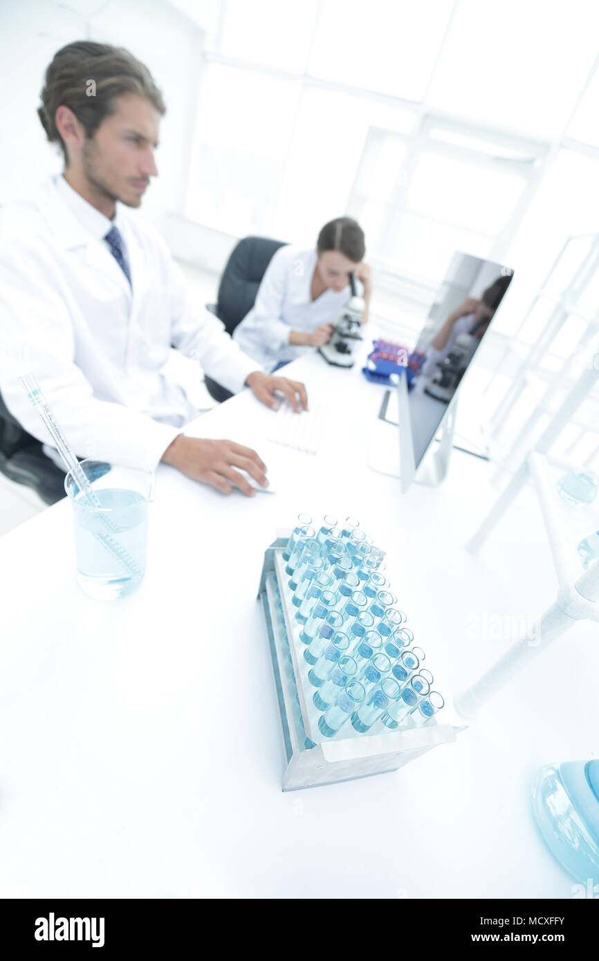 side view of scientists working in laboratory Stock Photo - Alamy