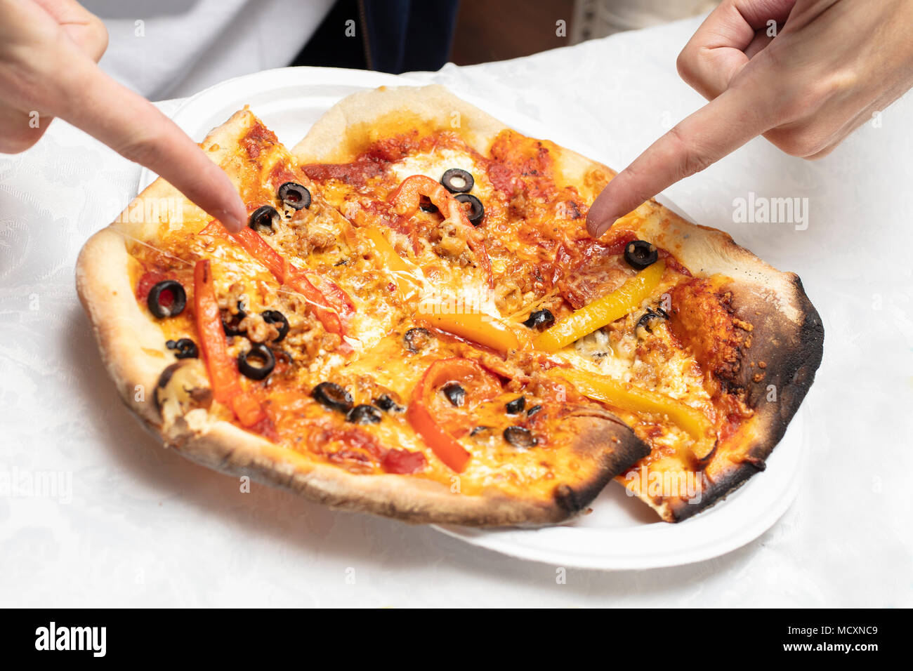 Man pointing at just made homemade pizza Stock Photo - Alamy