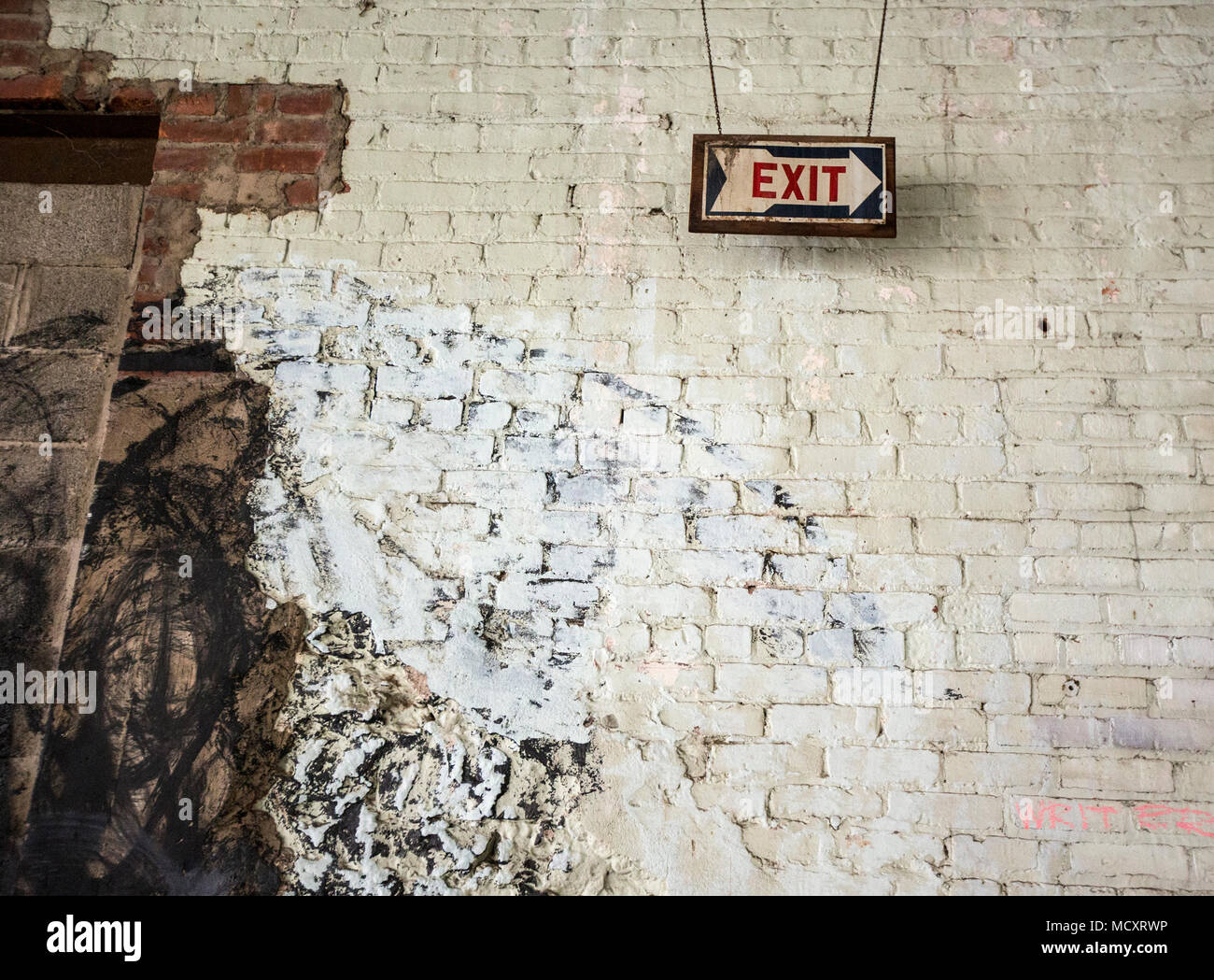 Exit sign on the interior wall of an old factory Stock Photo - Alamy