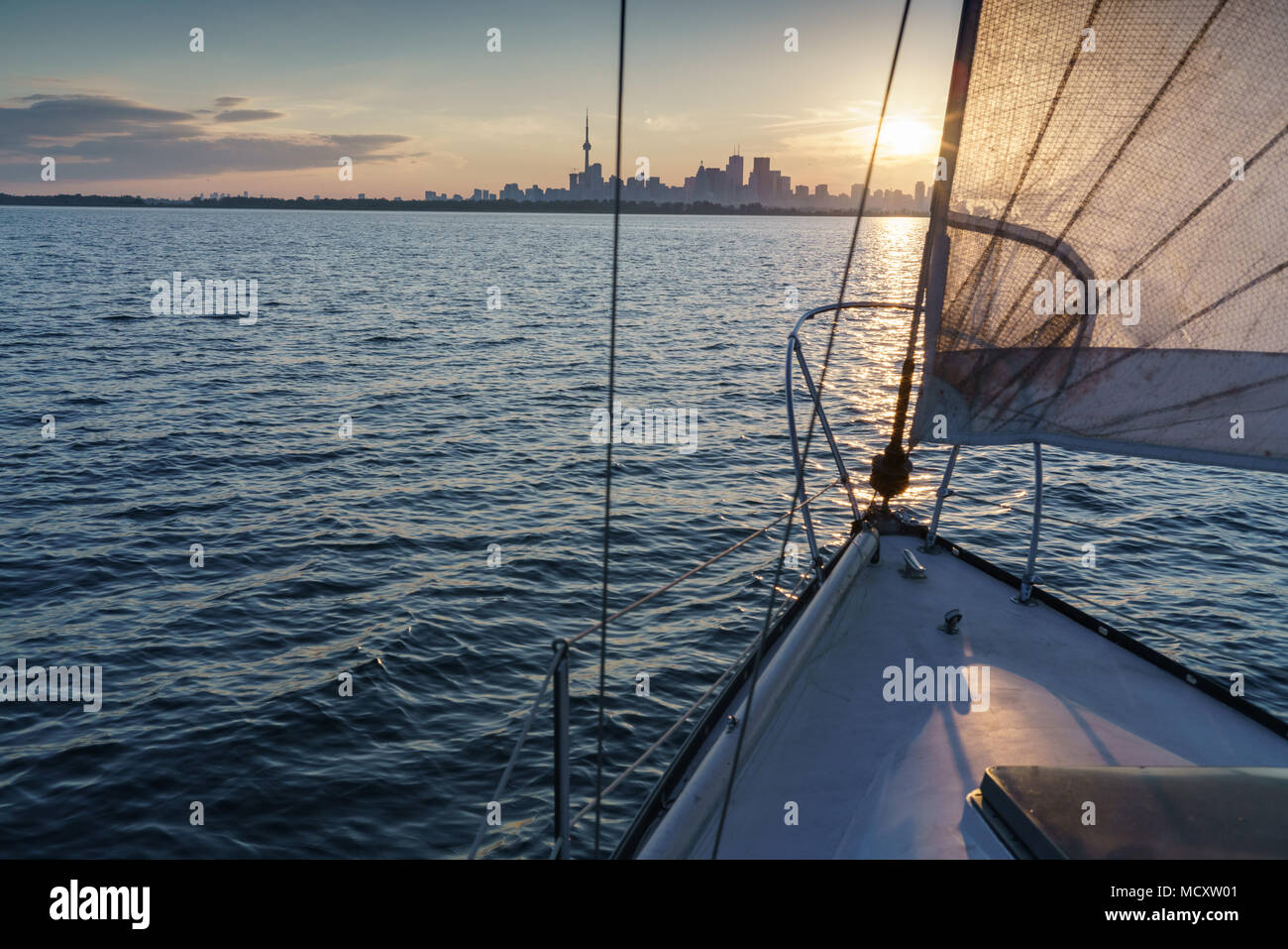 Sailboat and seascape with city skyline at distant, Toronto, Canada ...
