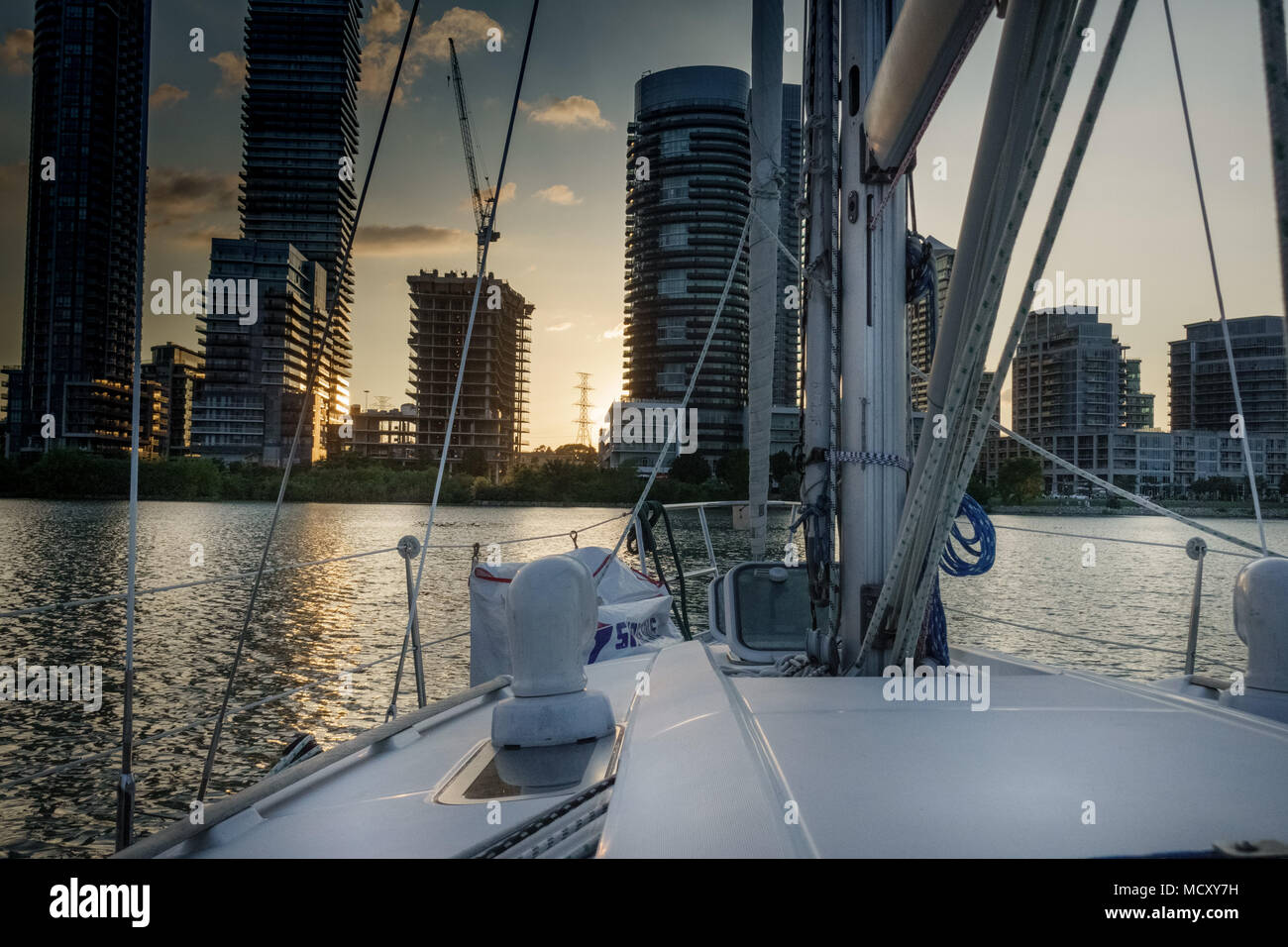 Sailboat and seascape with city skyline at distant, Toronto, Canada ...