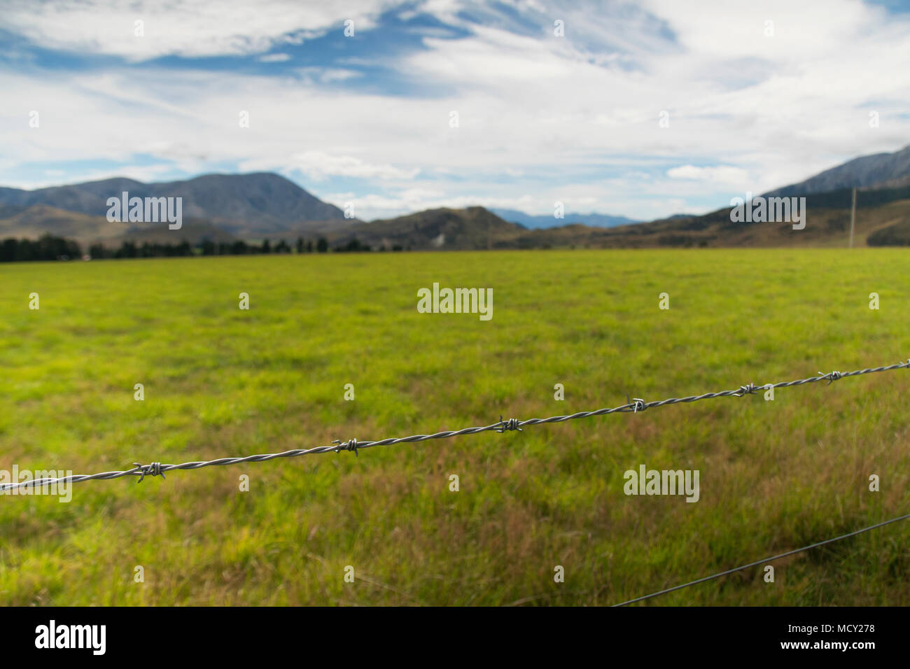 Barbed wire fence and mountain hi-res stock photography and images - Alamy