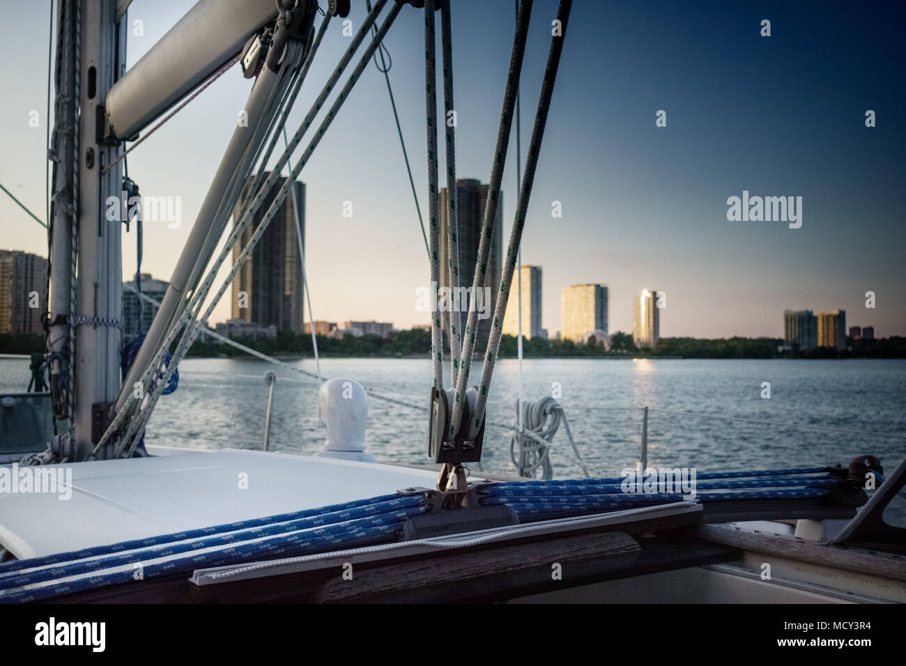 Sailboat and seascape with city skyline at distant, Toronto, Canada ...