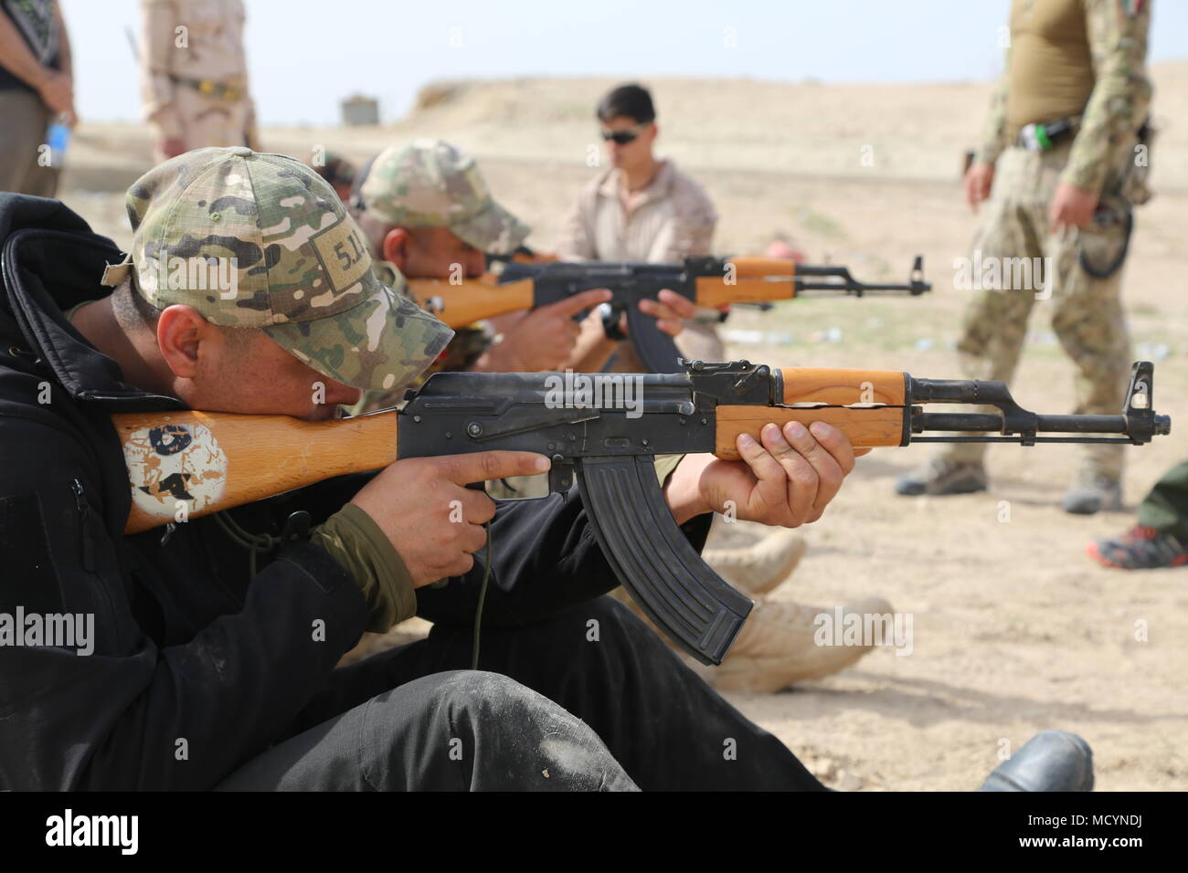 Iraqi soldiers with the Desert Battalion, Iraqi Army, demonstrate the ...