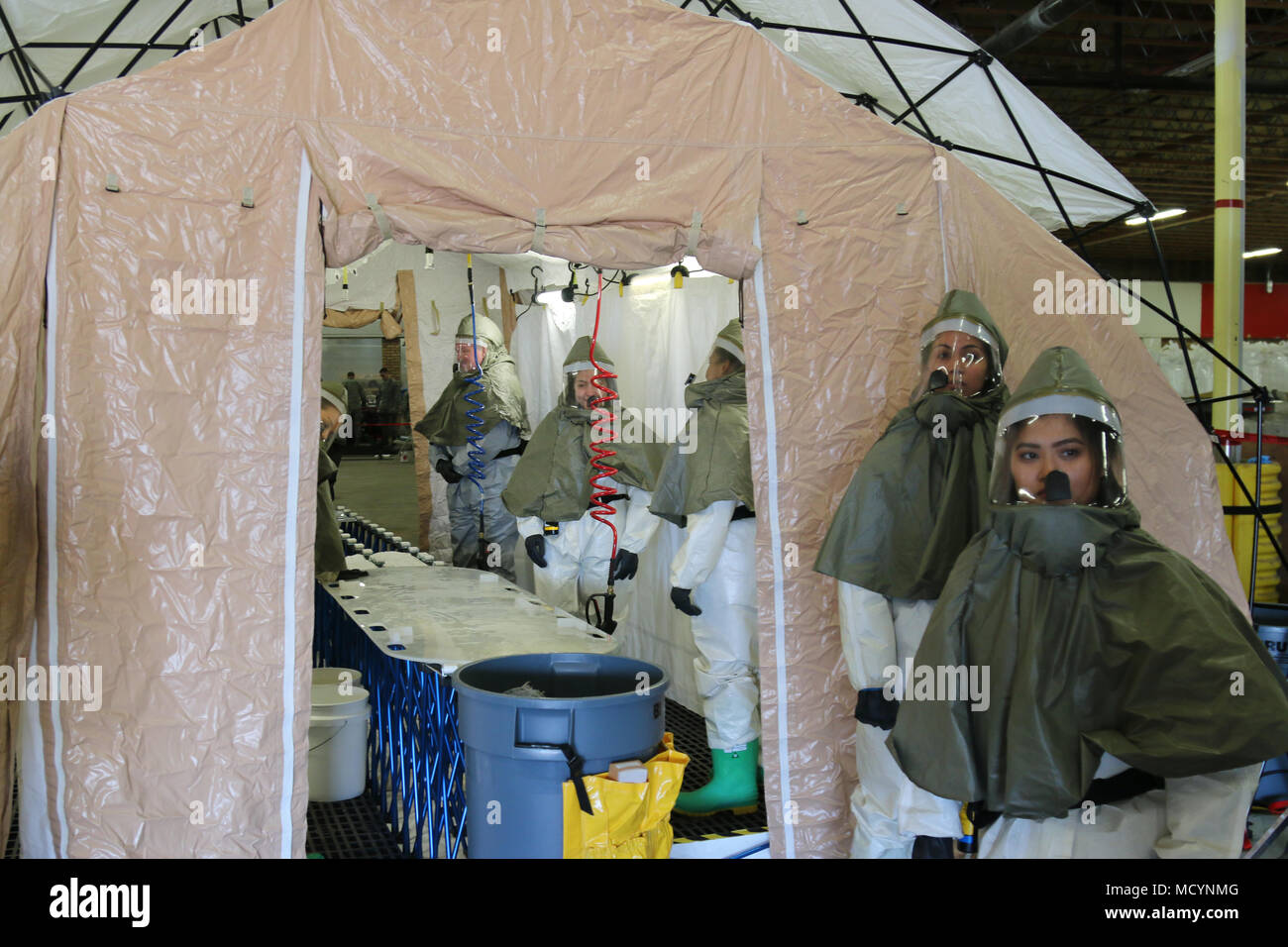 Airmen prepare for decontamination training at a mock casualty ...