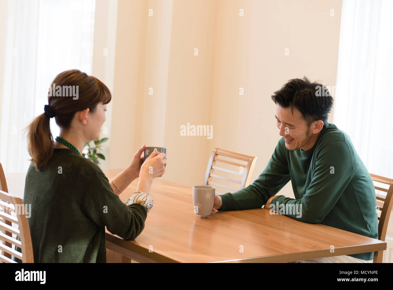 Talking married couple Stock Photo - Alamy