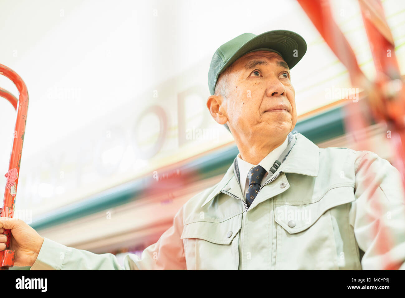 Senior man manager in supermarket (stock control Stock Photo - Alamy