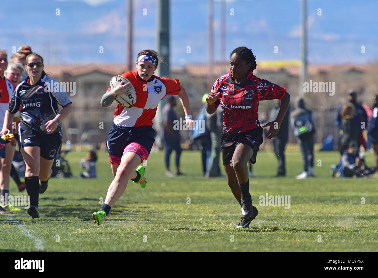 Coast Guard rugby player Megan Lewis-Taylor attempts a try while ...