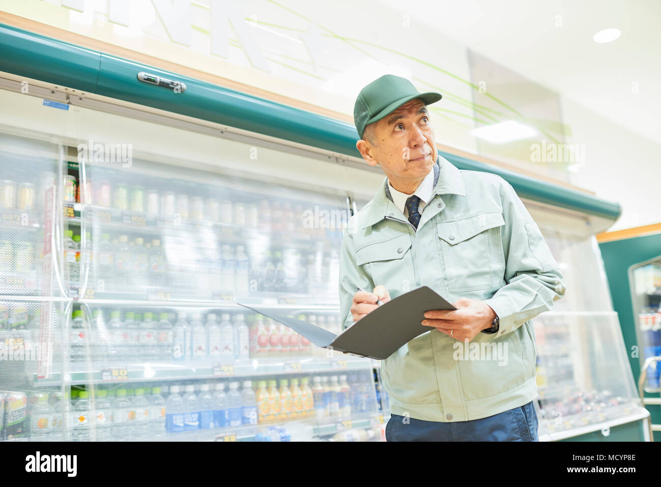 Senior man manager in supermarket (stock control Stock Photo - Alamy