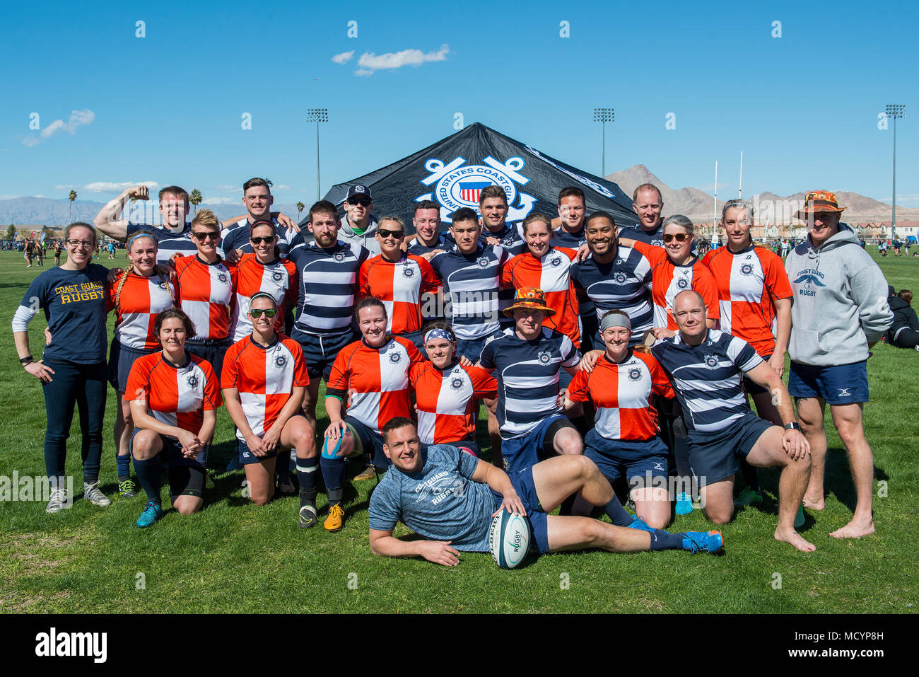 The Coast Guard men’s and women’s rugby teams pose together after ...