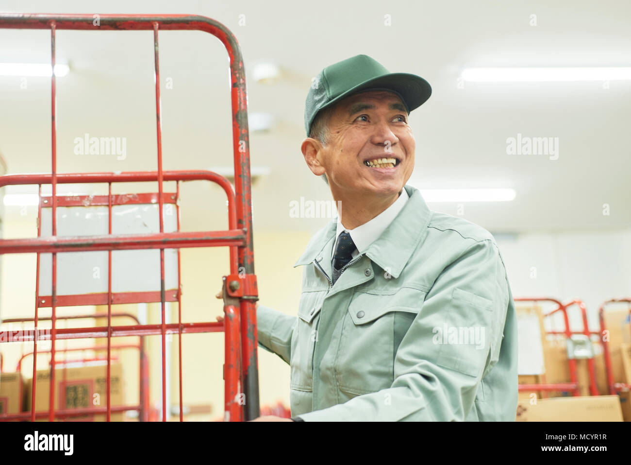 Senior man manager in supermarket (stock control Stock Photo - Alamy
