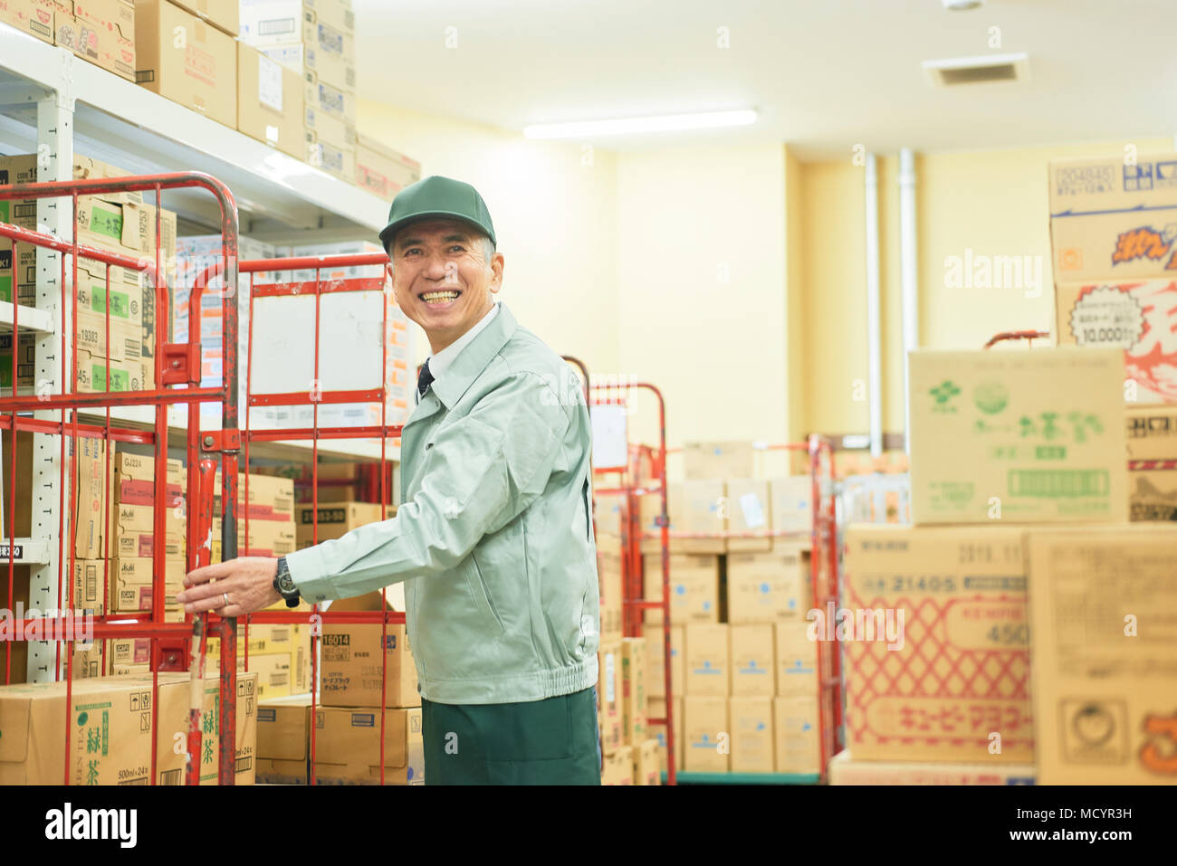 Senior man manager in supermarket (stock control Stock Photo - Alamy