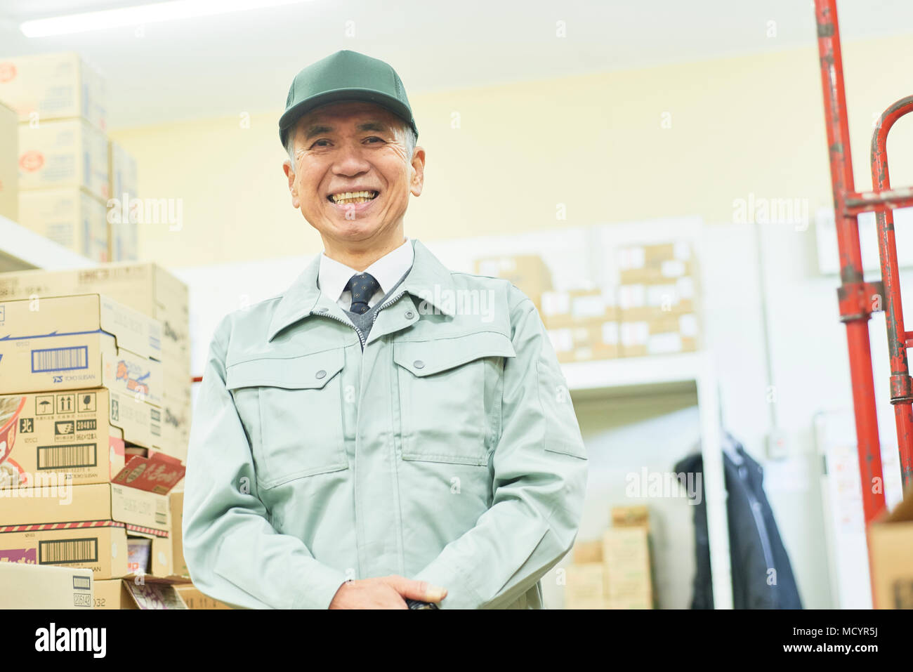 Senior man manager in supermarket (stock control Stock Photo - Alamy