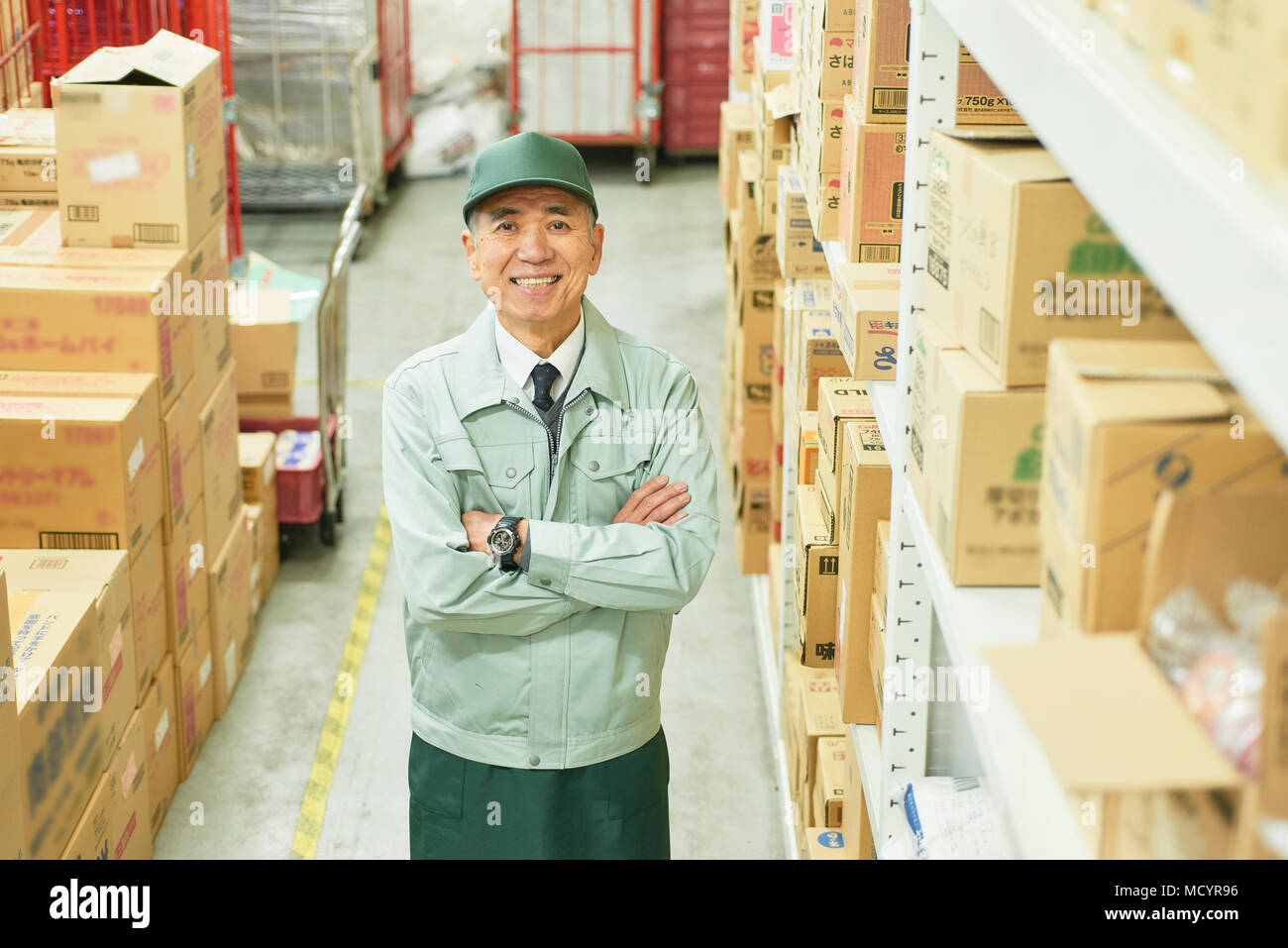 Man folding clothes in store hi-res stock photography and images - Alamy