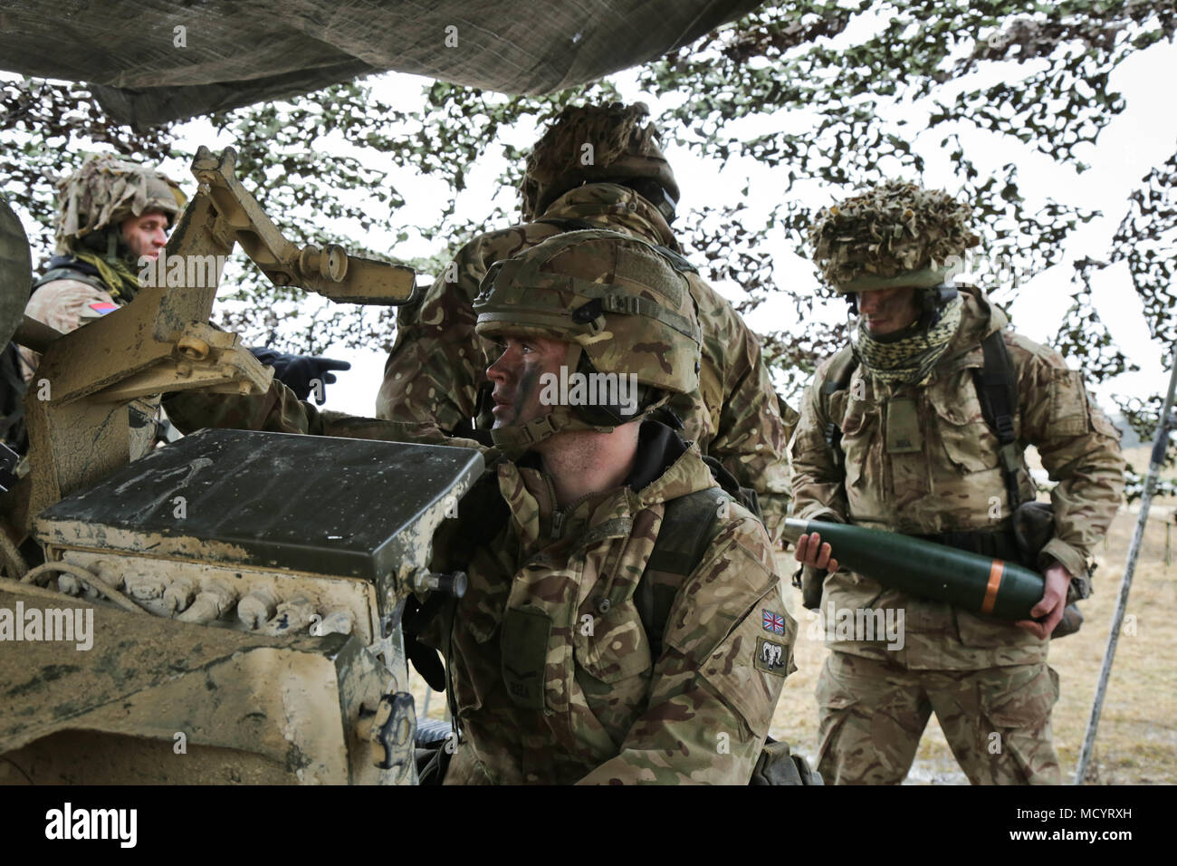 British soldiers of the 3rd Regiment Royal Horse Artillery load a L118 ...