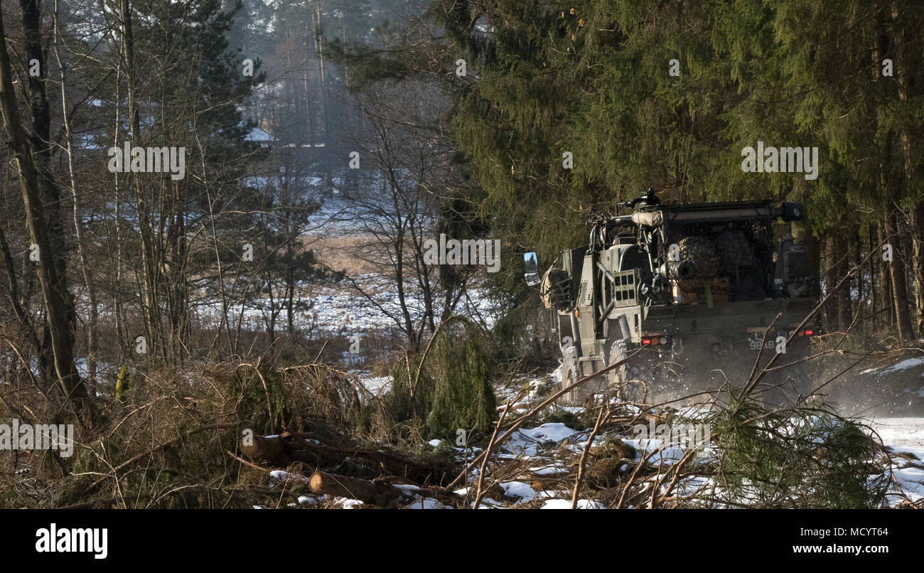 A British Jackal loaded with soldier heads to their station as they set ...