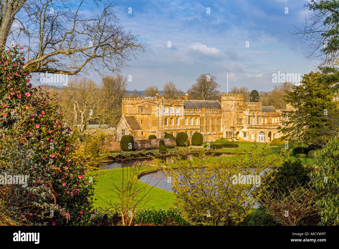 Winter sunshine lights up the facade of Forde Abbey with the frozen ...