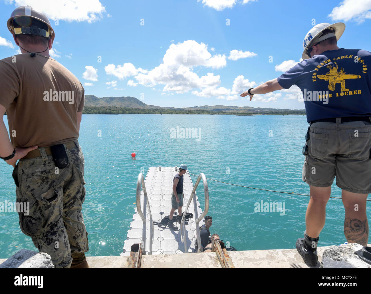 Navy Diver 1st Class Joshua Davis (right), assigned to the submarine ...