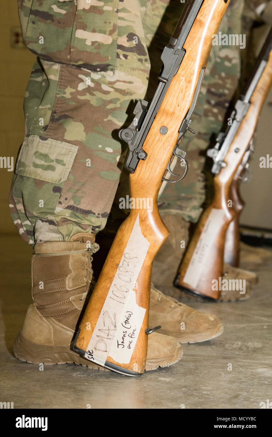 New York Army National Guard Soldiers ground their M-14 rifles while ...