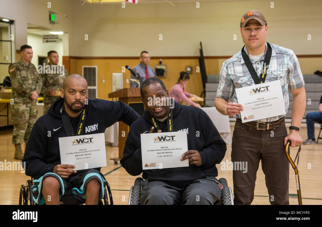 (From left) U.S. Army Spc. Brent Garlic, retired Sgt. 1st Class Carl ...
