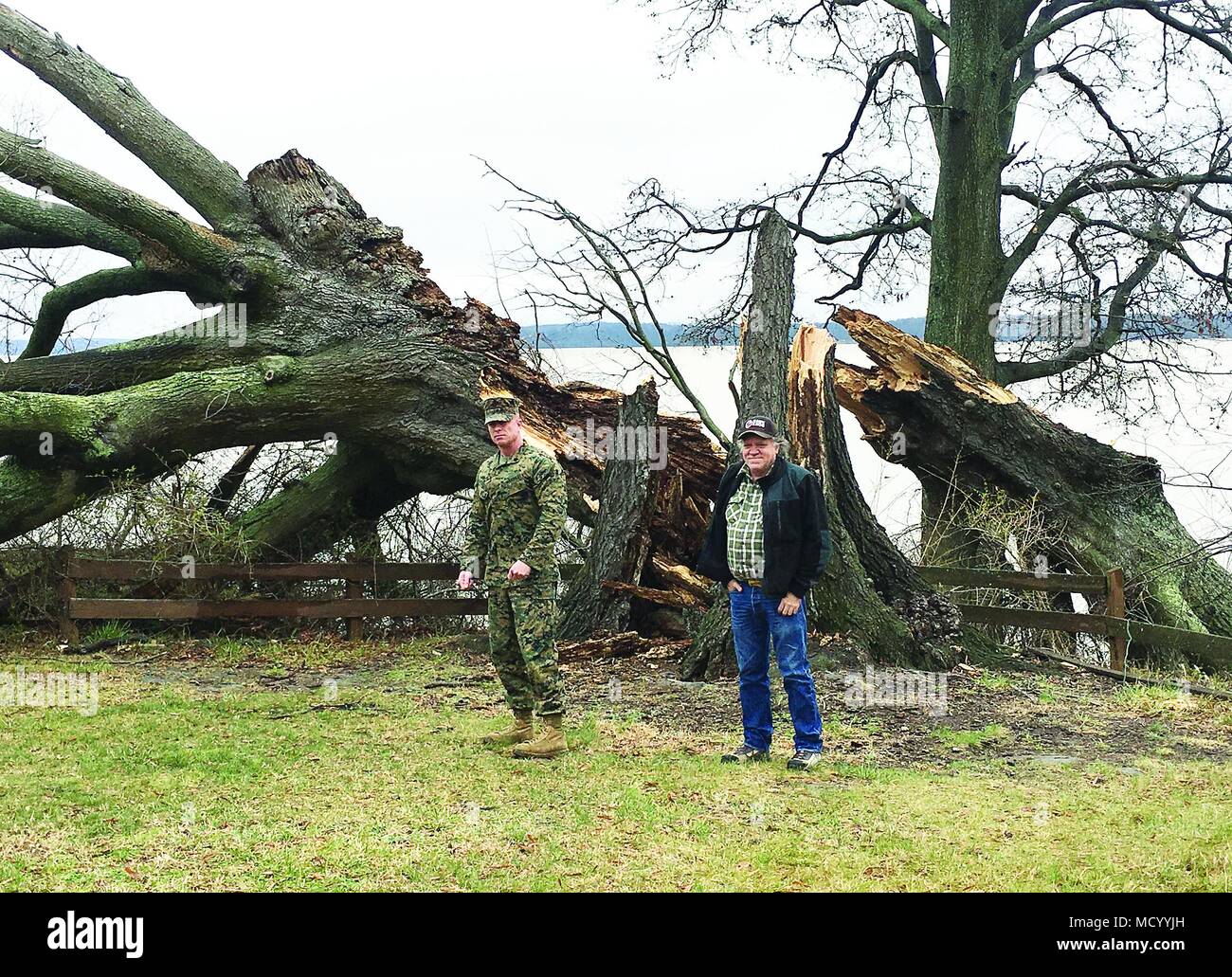 Gunnery Sgt. Eric Still and Ron Moyer, NREA forester, stand in front of ...