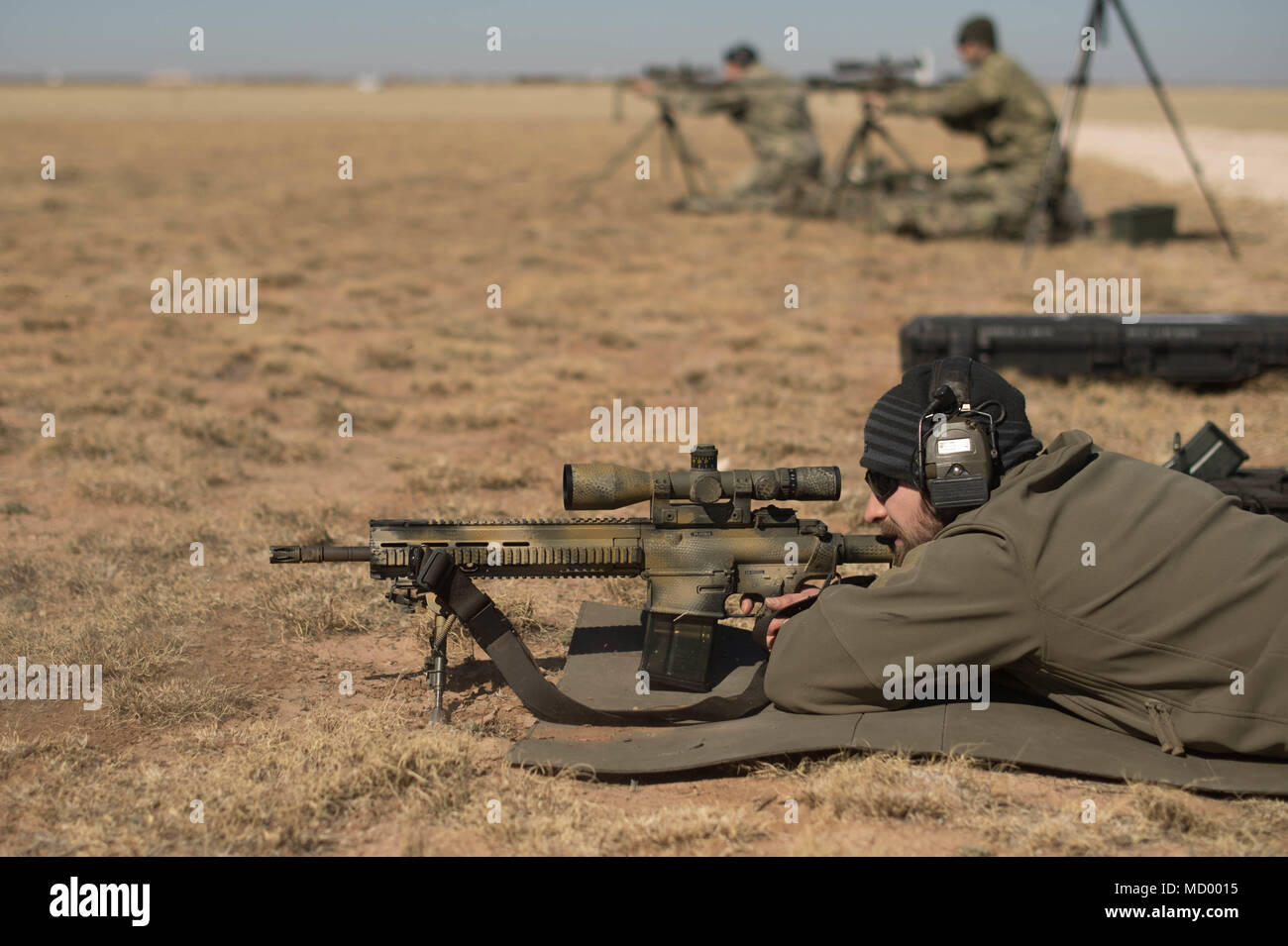A NATO sniper trains on firing at long distances with sniper rifle ...