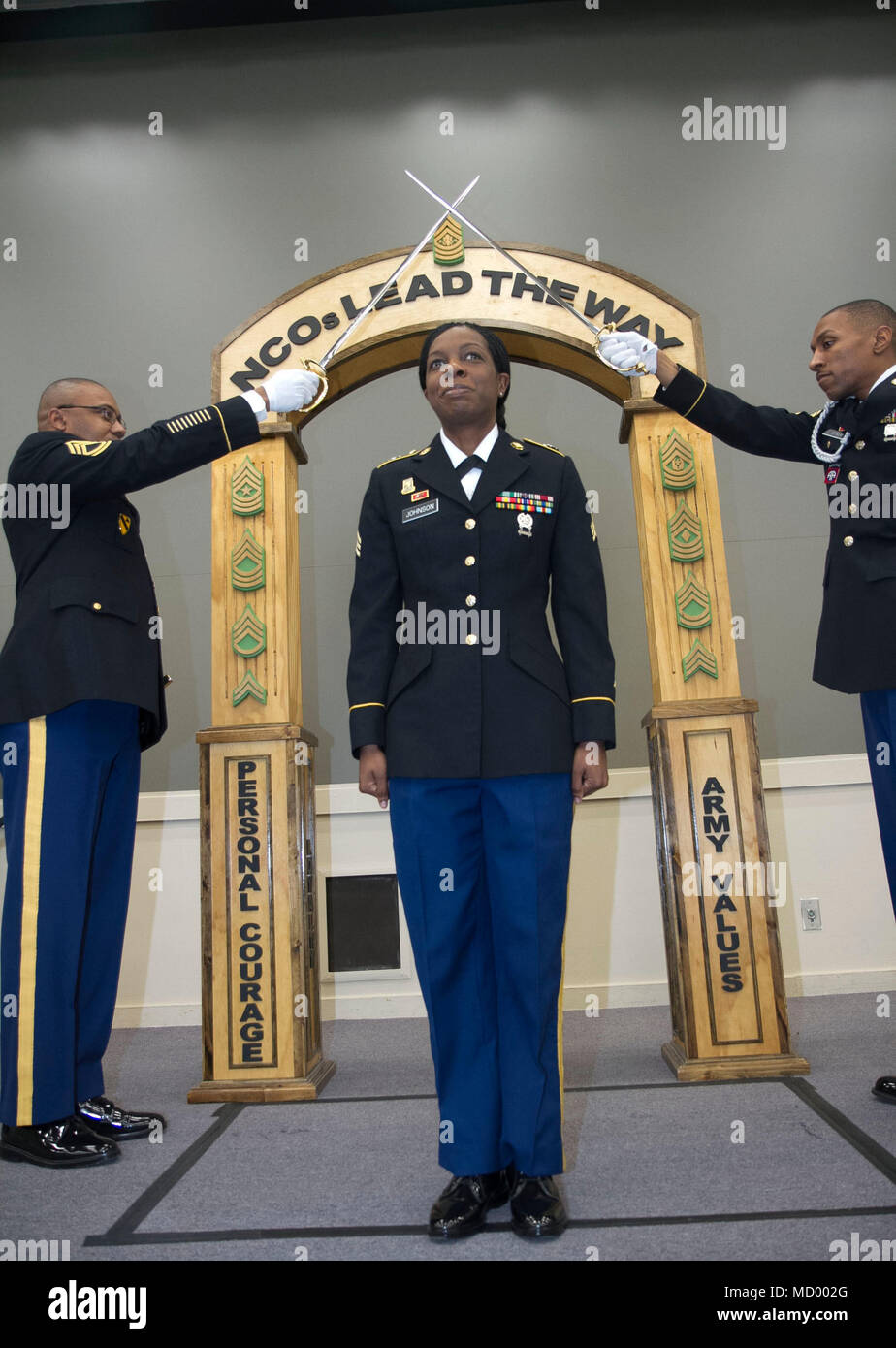 Sgt. Angela Johnson, G-6, 1st Theater Sustainment Command, walks under ...