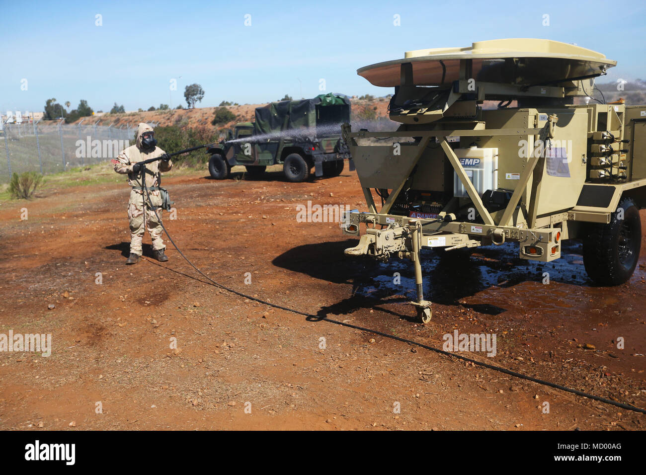 Marines with Marine Wing Communications Squadron 38 decontaminate a ...