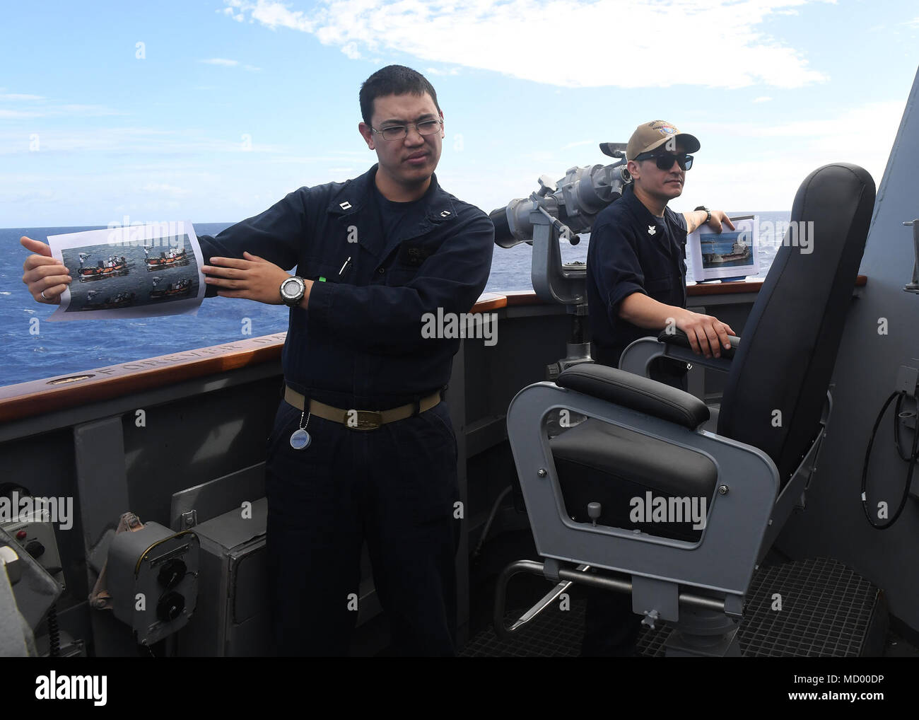 180306-N-FN963-0023 PACIFIC OCEAN (Mar. 6, 2018) Lt. Russ Isham, left ...