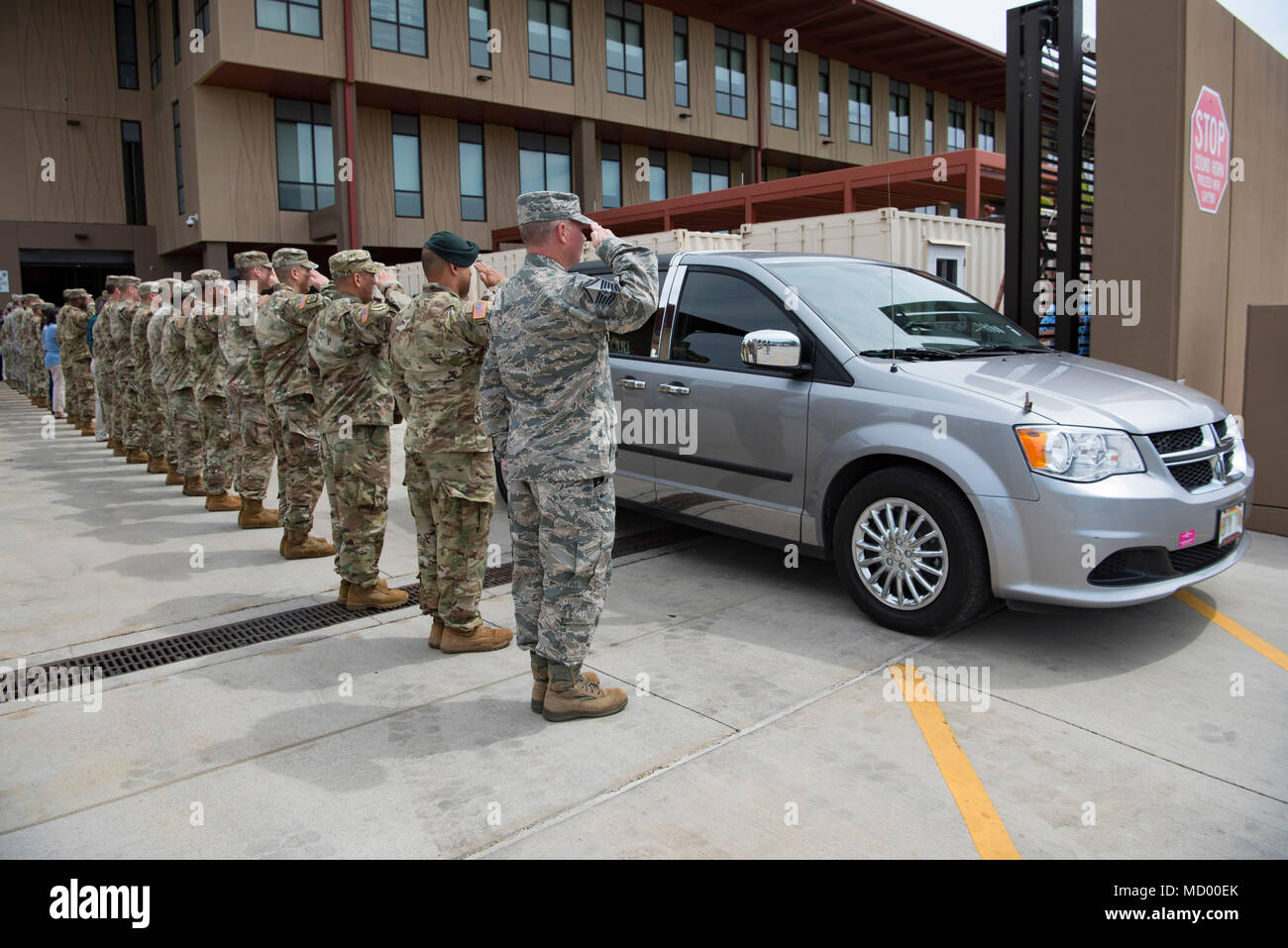 Members of the Defense POW/MIA Accounting Agency (DPAA) render honors ...