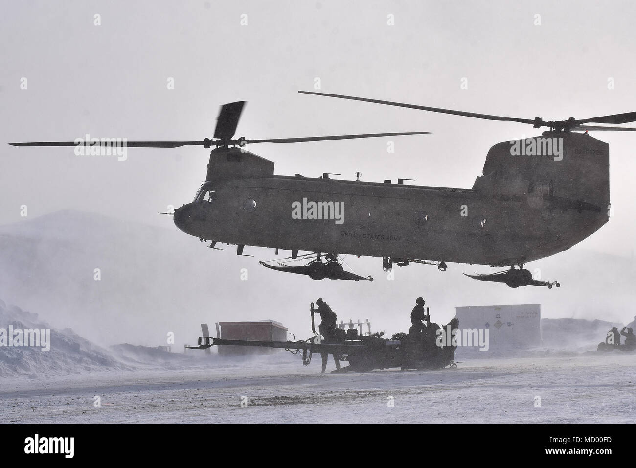 Blowing snow creates whiteout conditions as Soldiers from Battery B ...