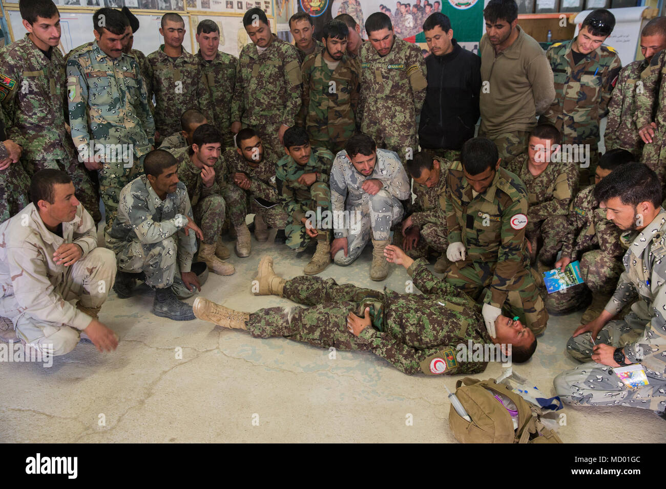 An Afghan instructor teaches soldiers with the 1st Kandak, 3rd Brigade ...