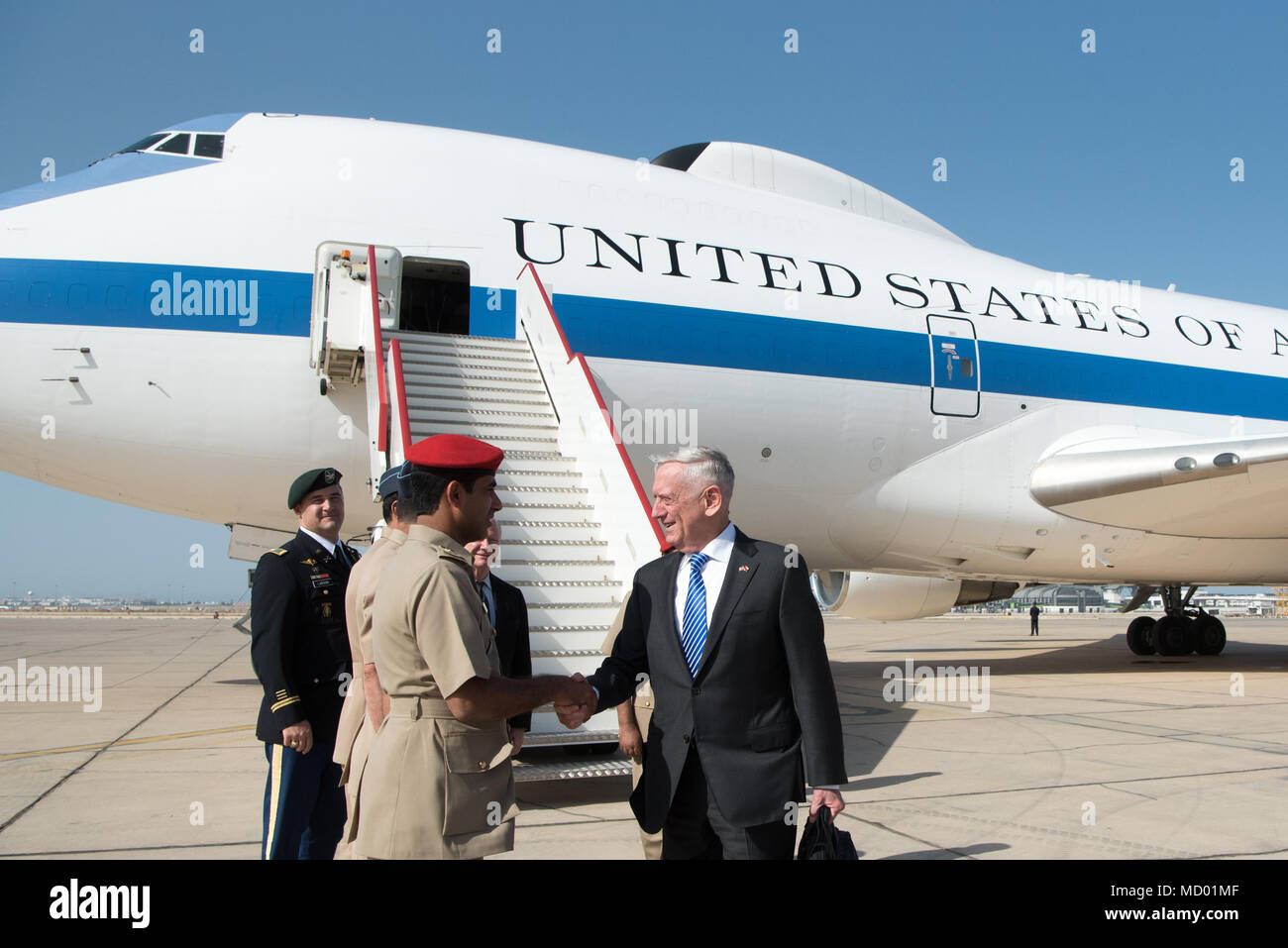 Defense Secretary James N. Mattis is greeted by local military members ...