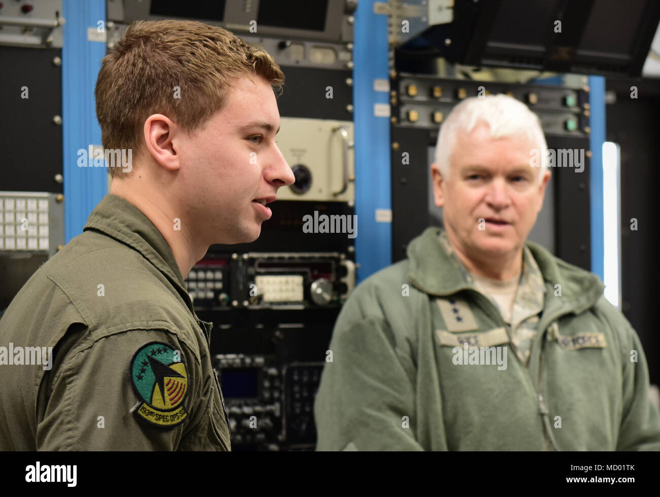 U.S. Airman 1st Class Michael Moore (left), airborne mission systems ...