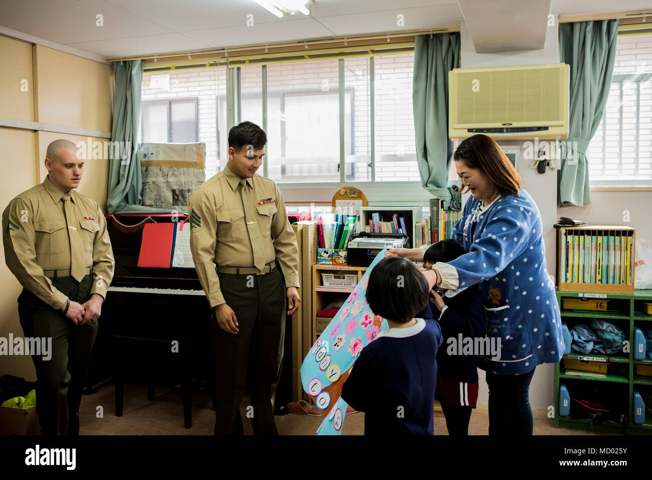 Students with Kinnan Hoikuen present U.S. Marine Corps Lance Cpl. Jacob ...