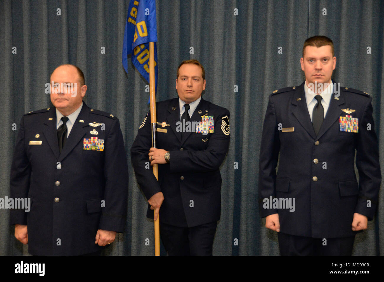 U.S. Air Force Lt. Col. Ryan Harvey (right) assumes command of the ...